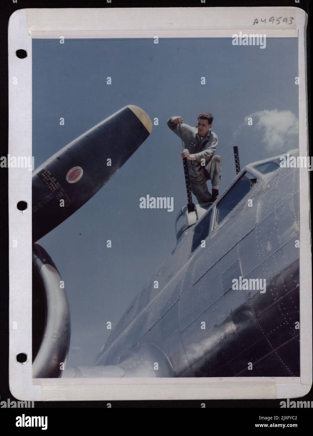 Cpl. James E. Dunbar, Gunnery Mechanic, Runs A Patch Thru Top Turret ...