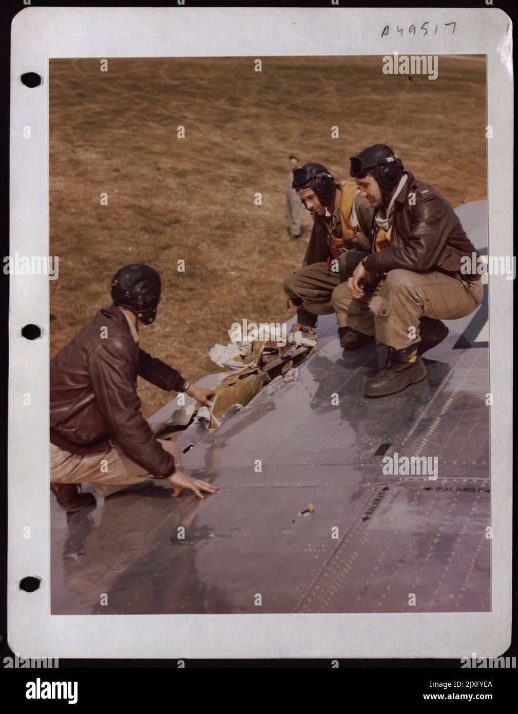 Crew Of The Boeing B-17 'Peacemaker' Examines Battle Damage To The Wing ...