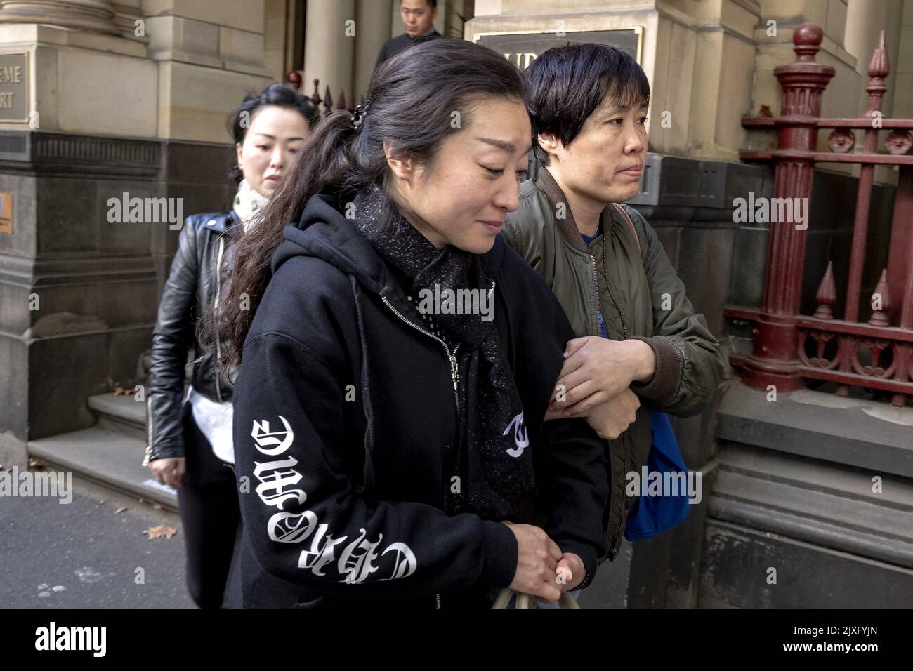 Mother of Jeremy Hu, Liping Yuan (left) leaves the Melbourne Supreme ...