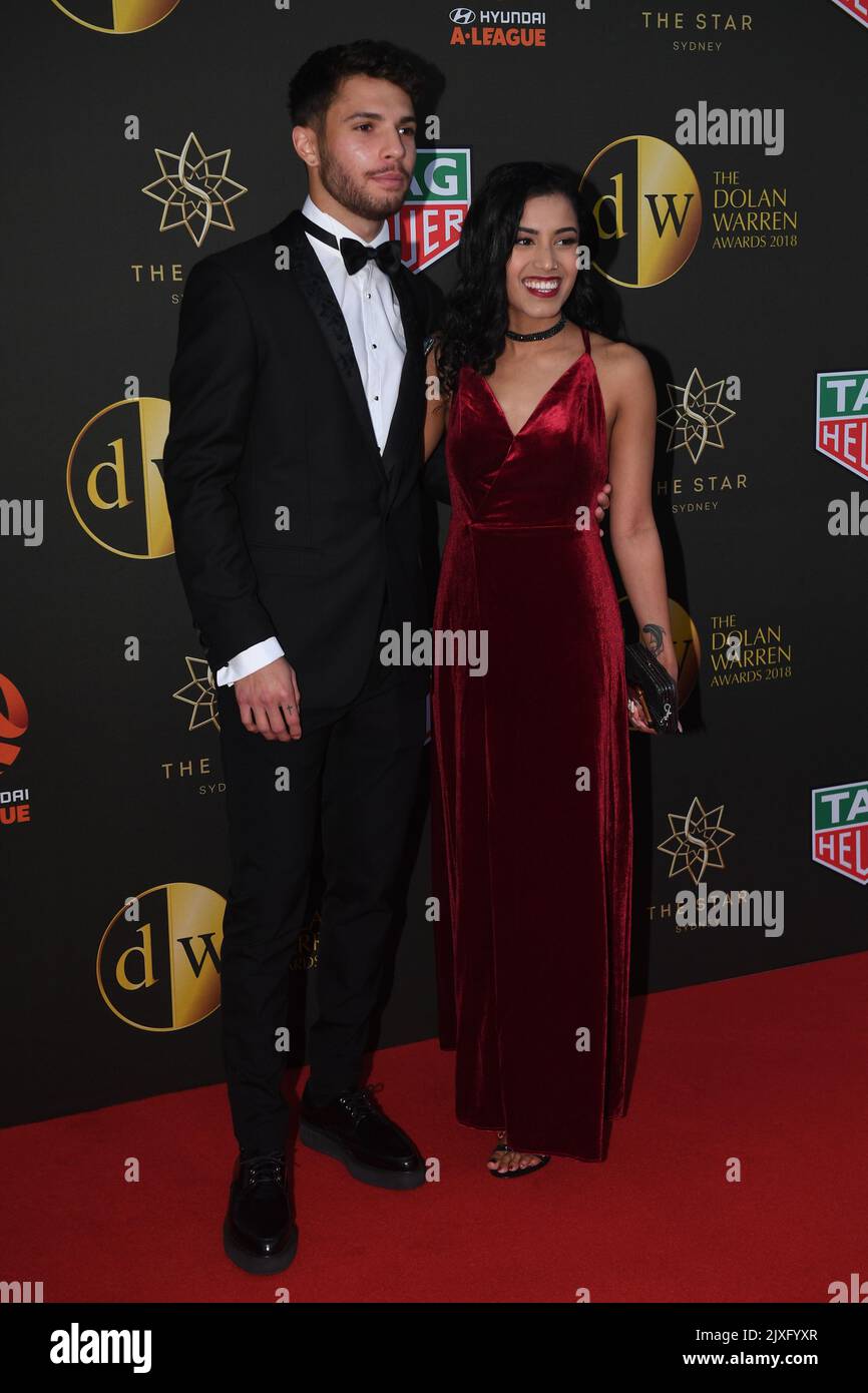 A-League player Daniel De Silva (left) and his partner Sharon arrive ...