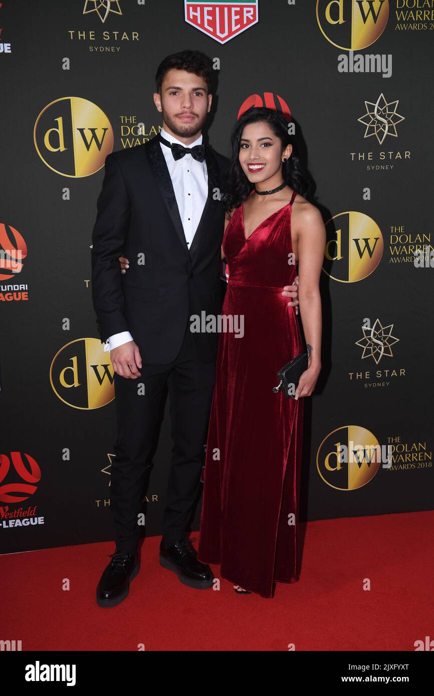 A-League player Daniel De Silva (left) and his partner Sharon arrive ...
