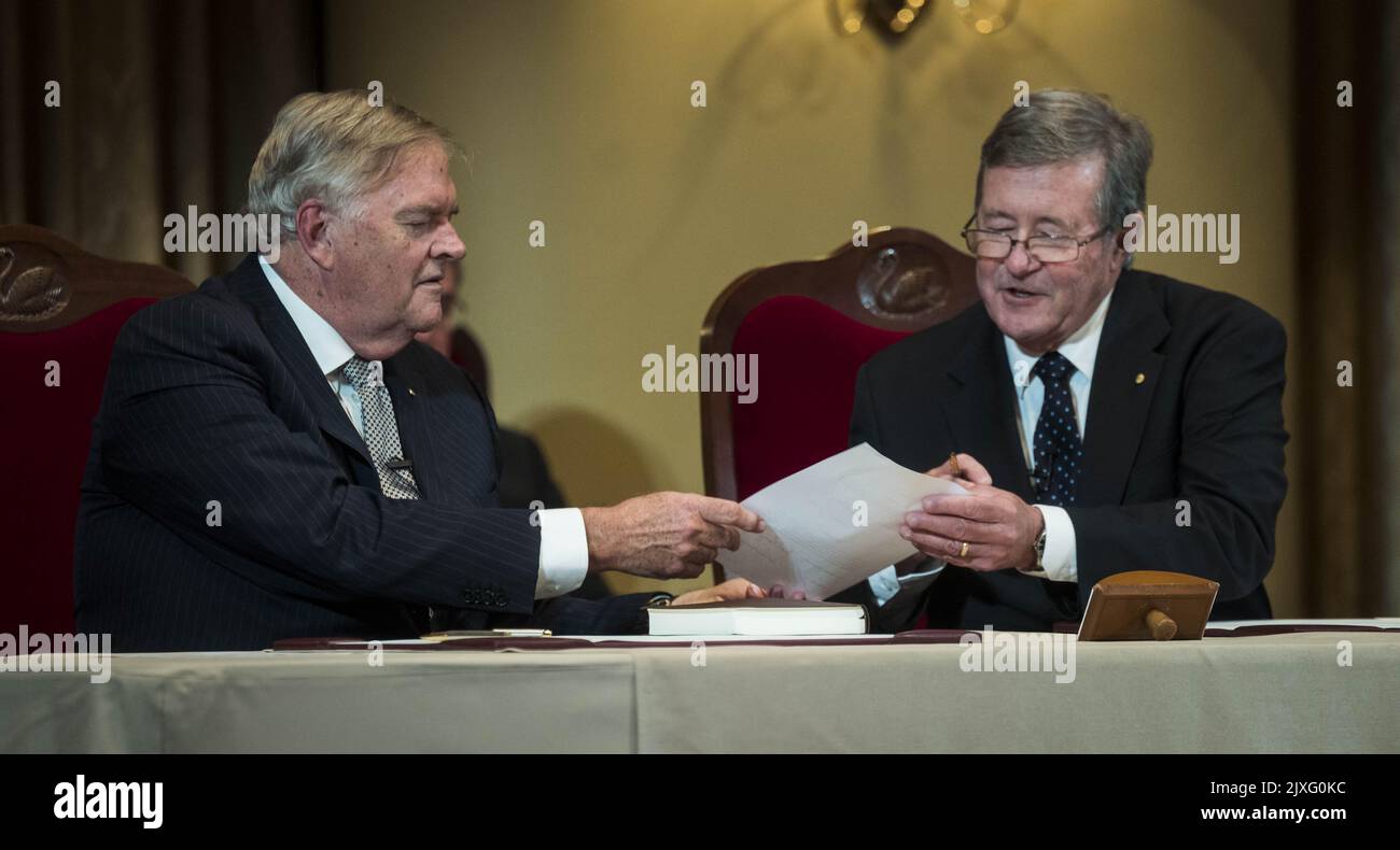 The Hon. Kim Beasley AC, signs the oath as he is sworn in as the new ...