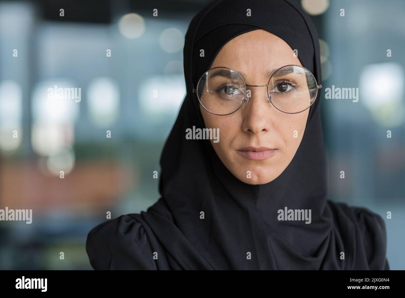 Close-up photo of business woman in black hijab, muslim woman working ...