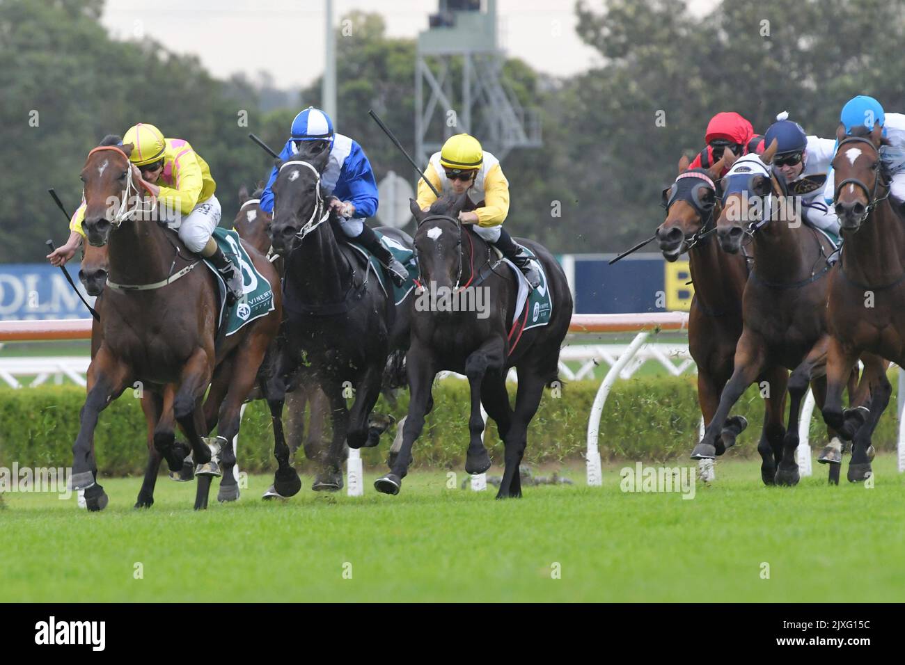 Jockey Koby Jennings rides Dawn Dawn (left) to victory in Race 3, the ...