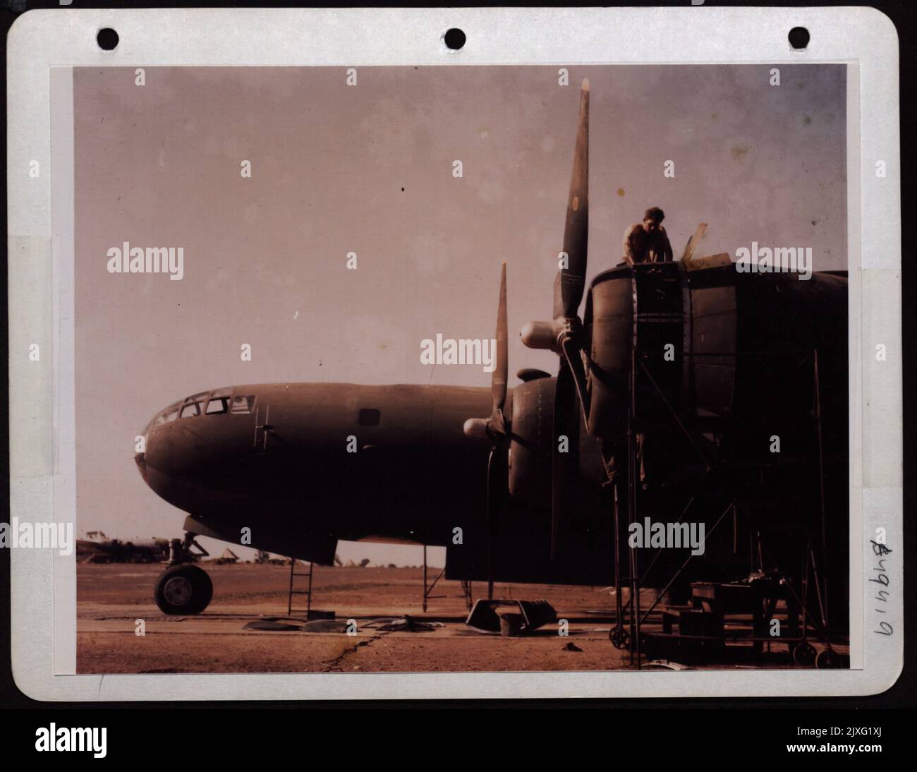 Mechanics Working On Engine Of A B-29 At A Base In China Stock Photo ...