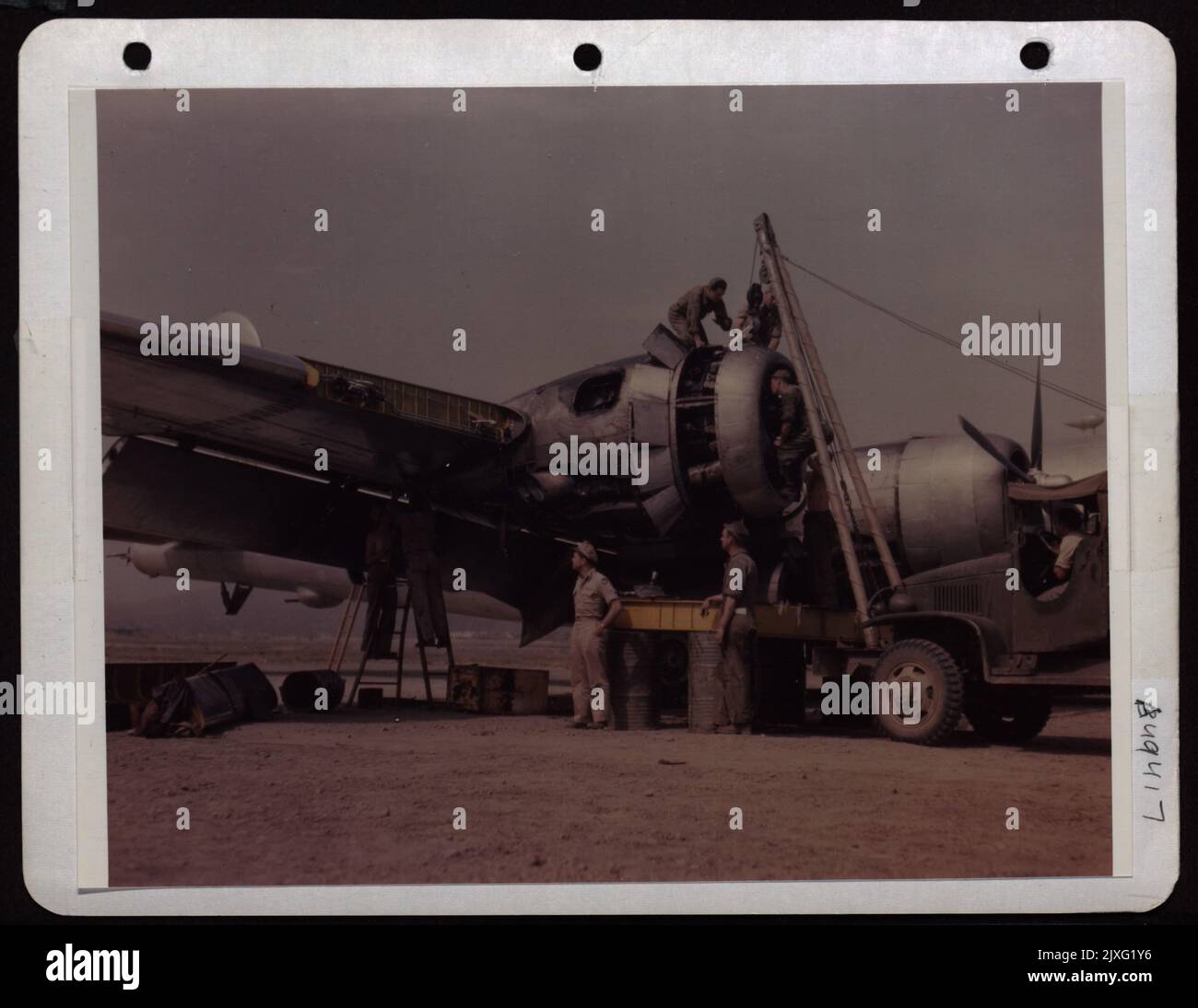 Maintenance Crew Works On The Engine Of A Boeing B-29 In China Stock ...