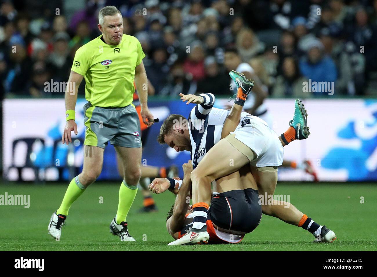 Zach Tuohy of the Cats (right) wrestles with Matt De Boer of the Giants ...