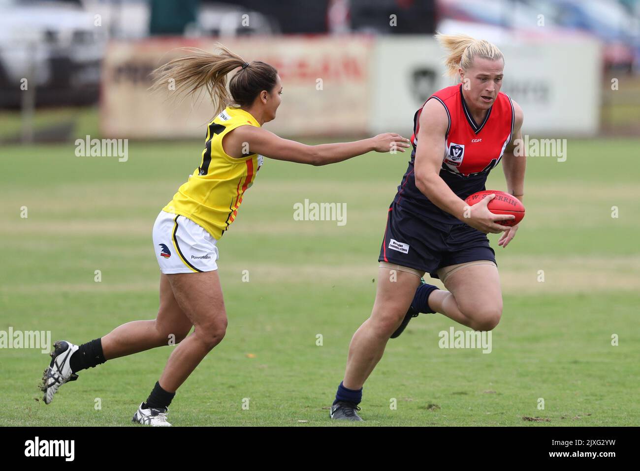 Transgender footballer Hannah Mouncey (R) playing in the VFLW Darabin ...