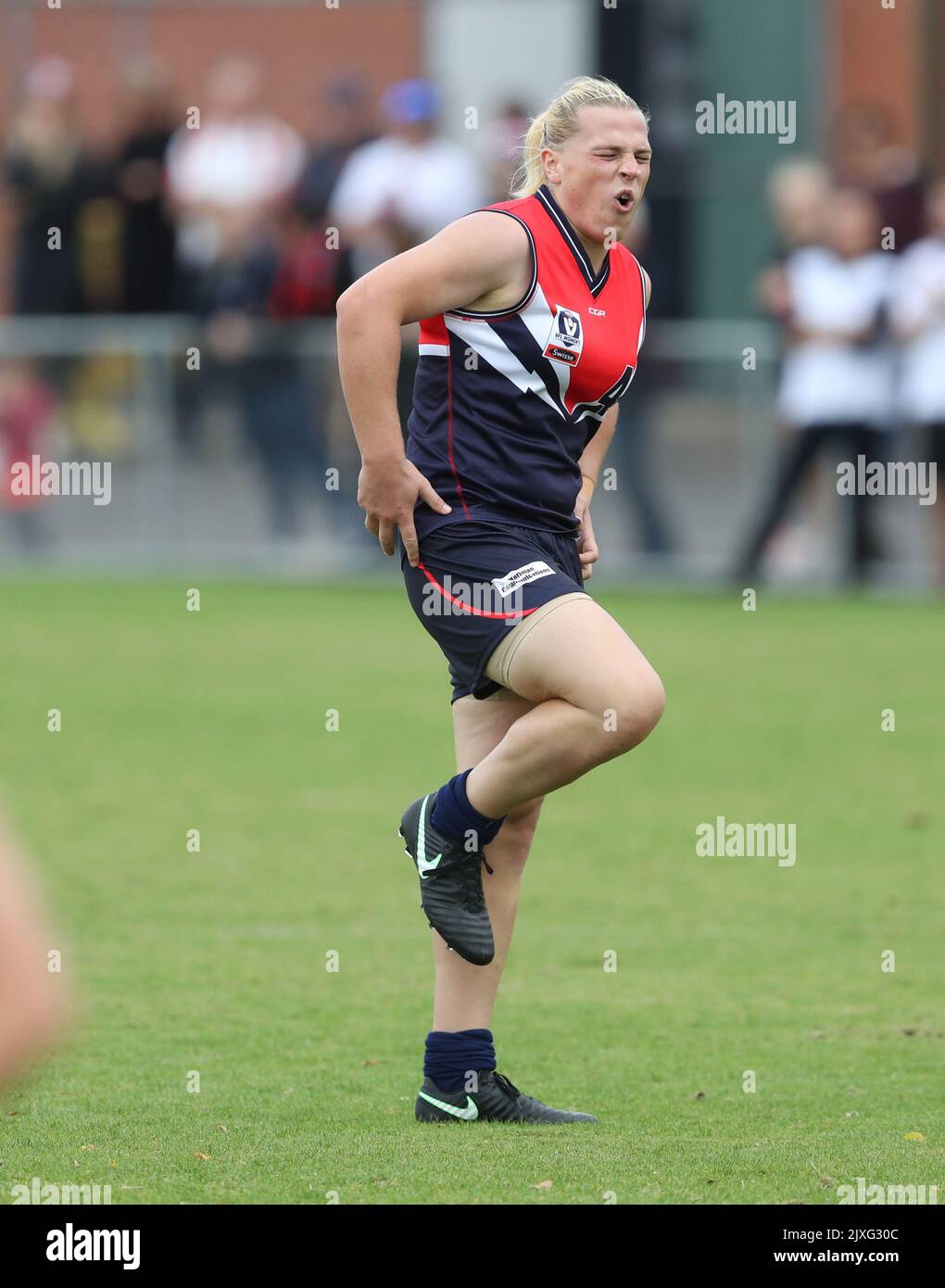 Transgender footballer Hannah Mouncey shows pain after a kick while ...