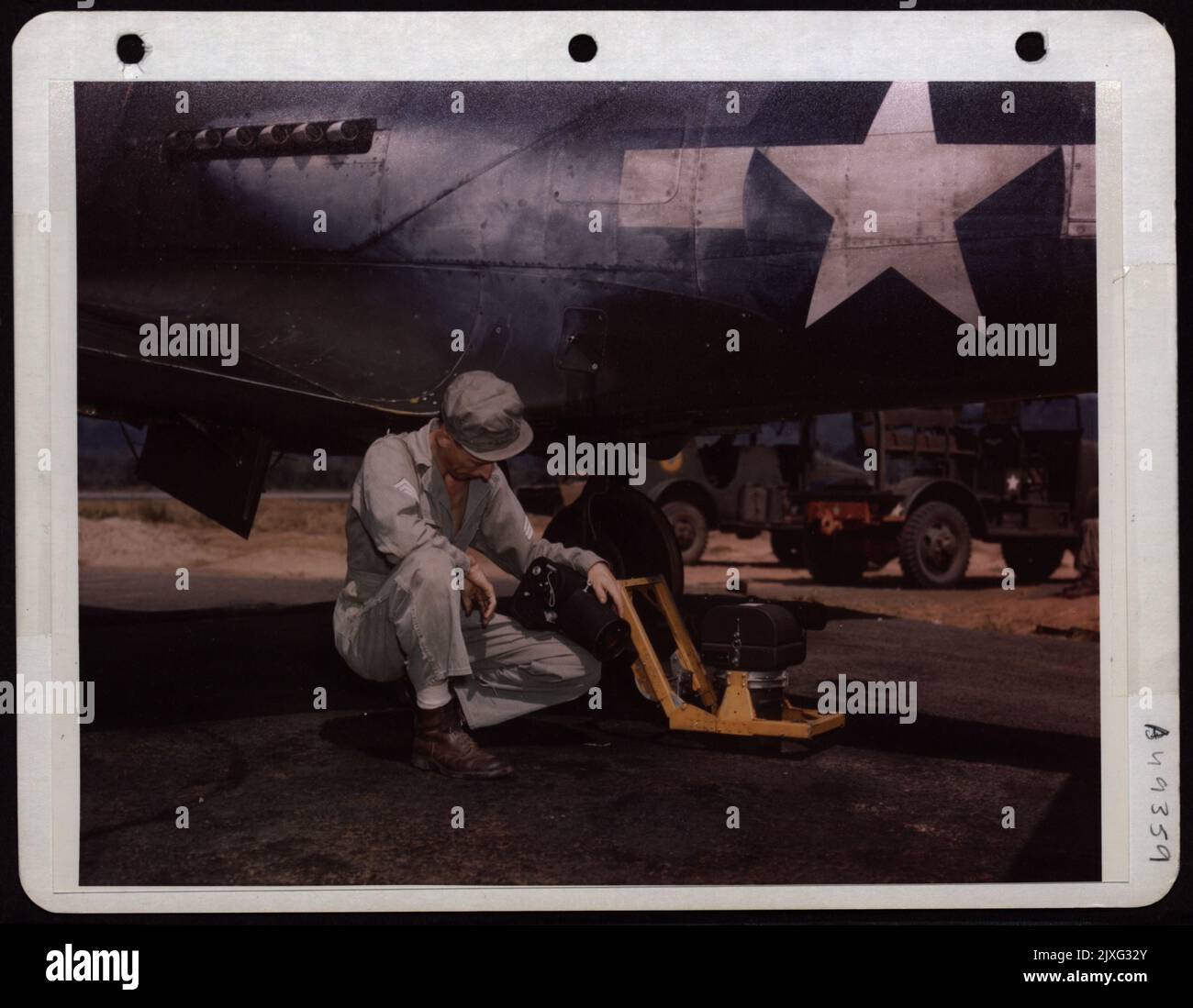 Sgt. Howard W. Thomas Installs K-25 Camera In A Bell P-39. Panama Stock ...