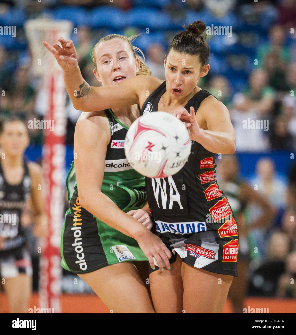 Jessica Anstiss of the Fever and Madi Robinson of the Magpies during ...