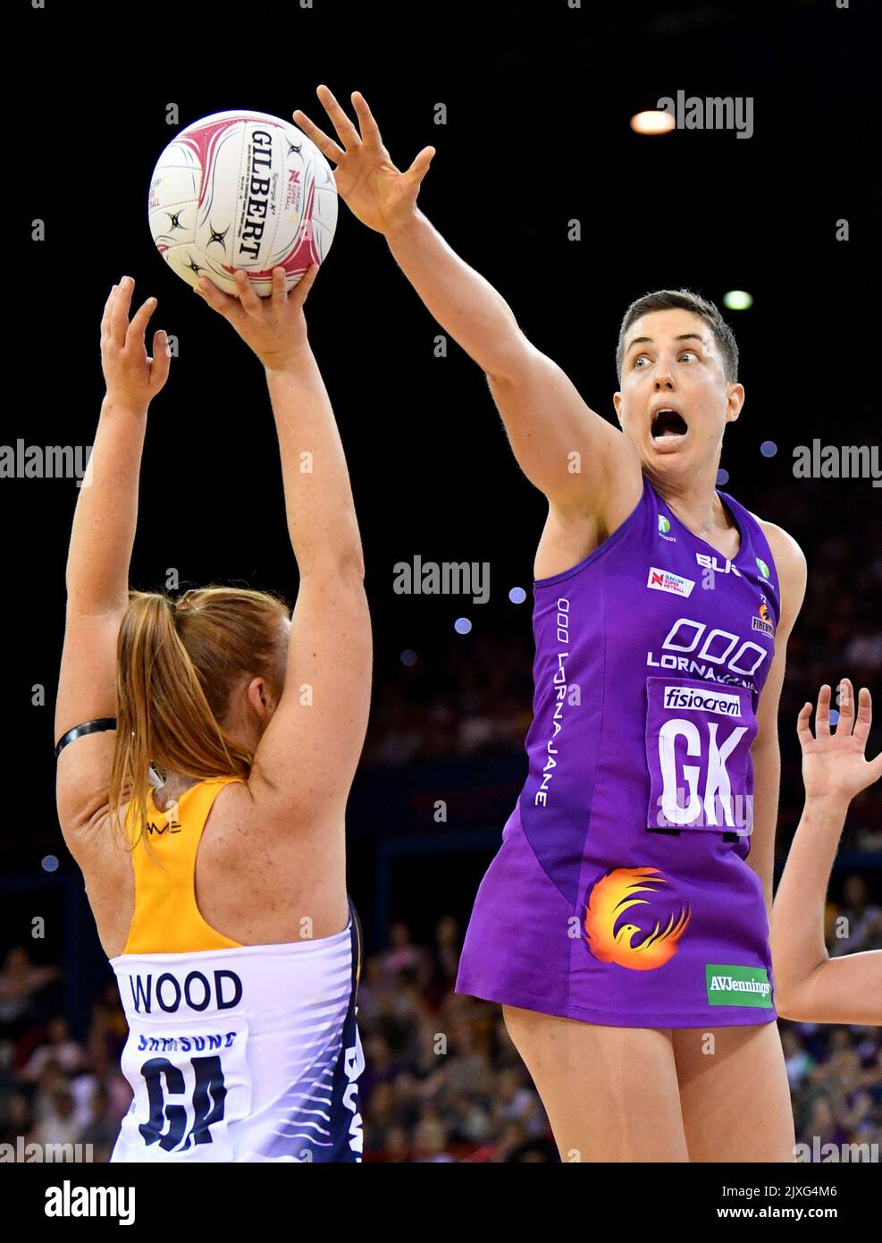 Laura Clemesha (right) of the Firebirds tries to block Stephanie Wood ...