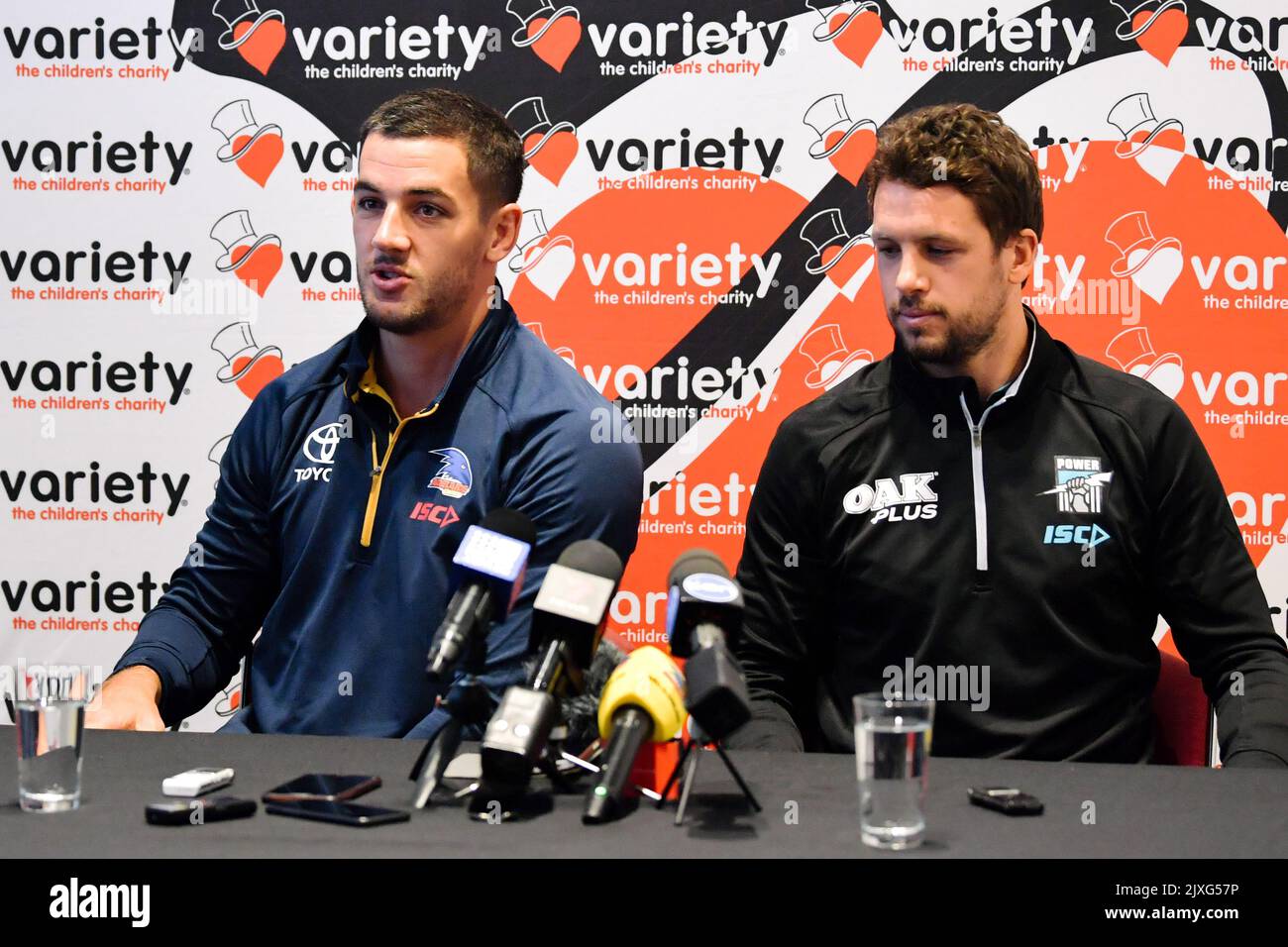 Adelaide Crows Captain Taylor Walker (L) and Port Power Captain Travis ...