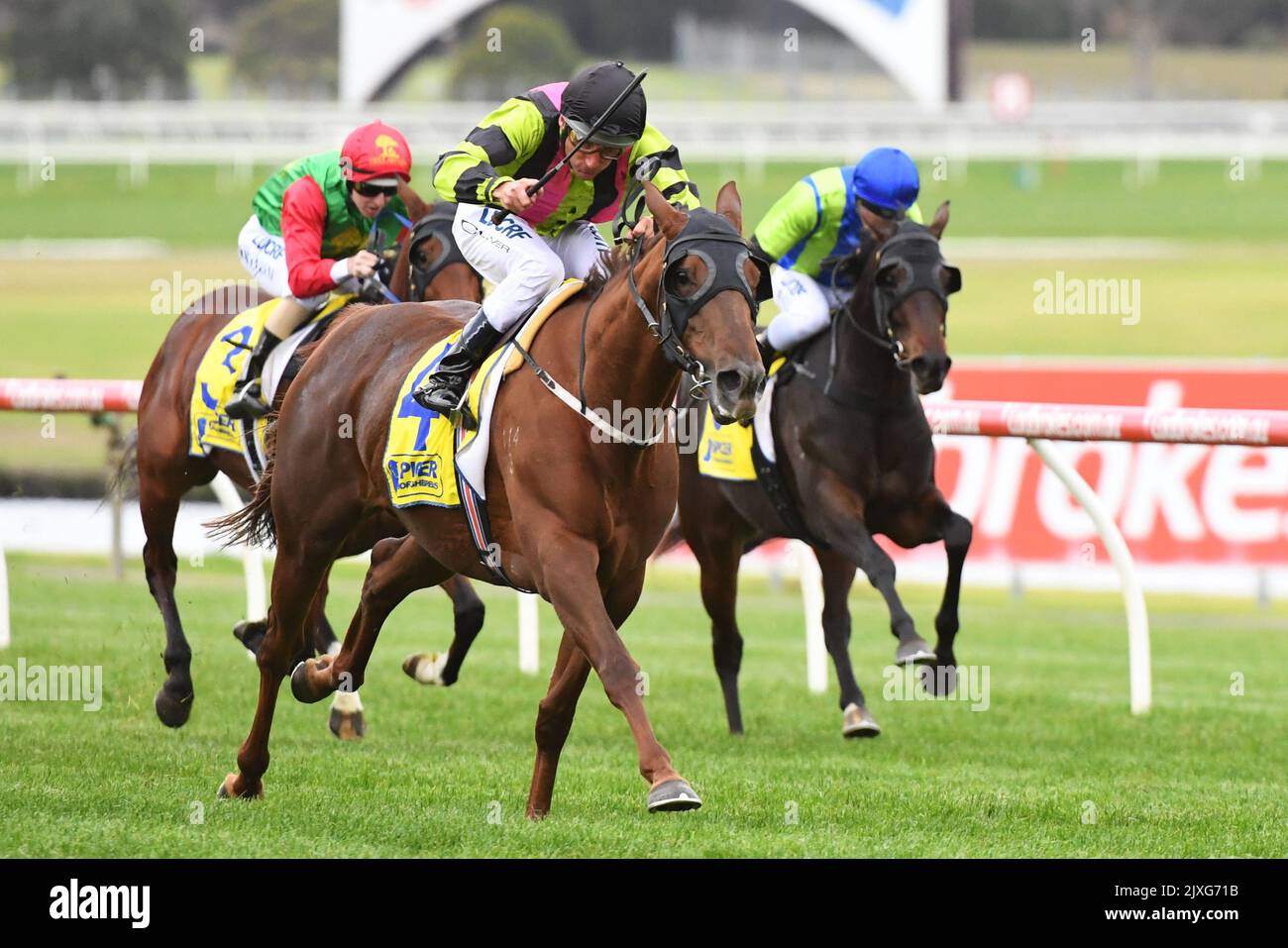 Jockey Damien Oliver (centre) rides Groovin to victory in race 5, the ...
