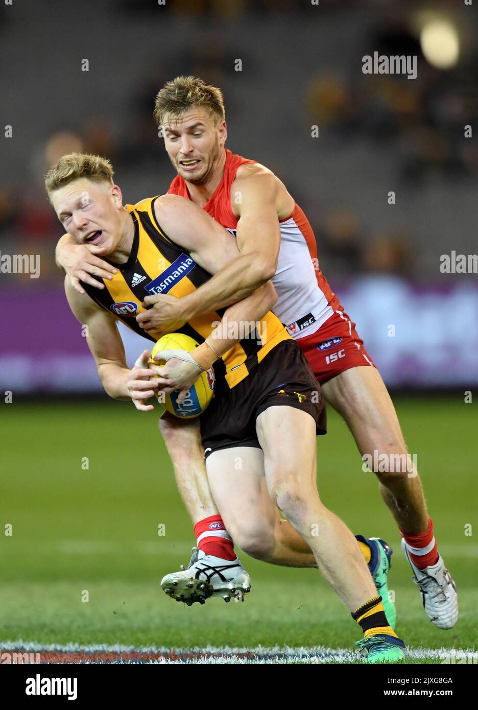 Kieren Jack of the Swans tackles James Sicily of the Hawks during the ...