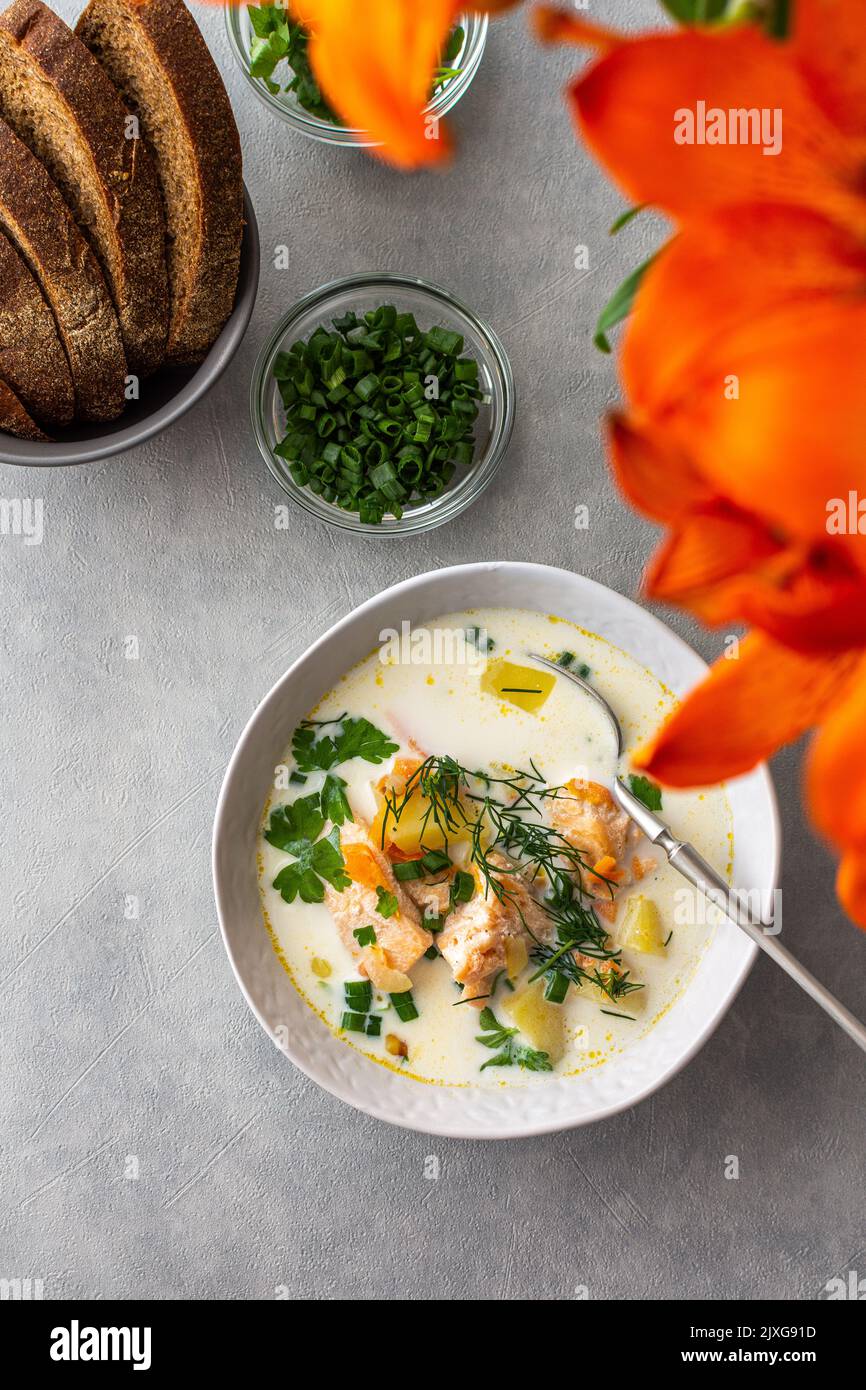Norwegian salmon red fish soup with vegetables, herbs and cream, top ...