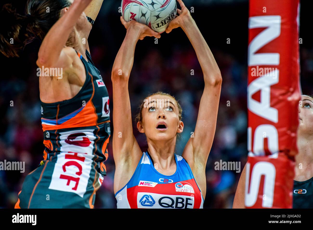 Helen Housby (right) of the Swifts competes for possession against the ...