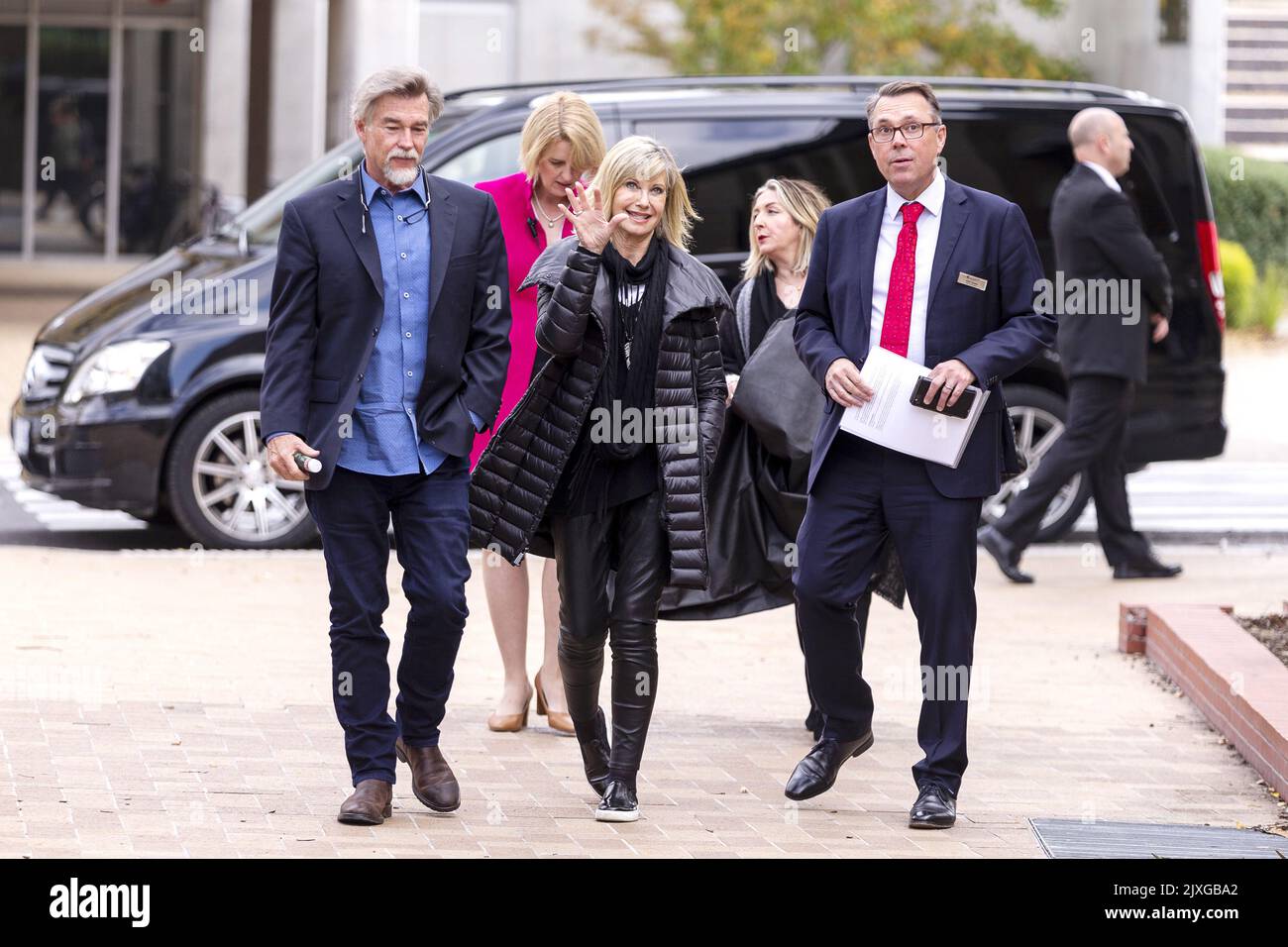 Olivia Newton-John arrives with husband John Easterling (left) ahead of ...