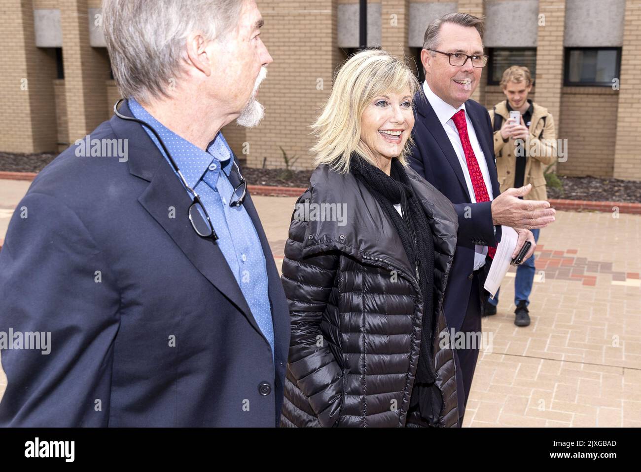 Olivia Newton-John arrives with husband John Easterling (left) ahead of ...