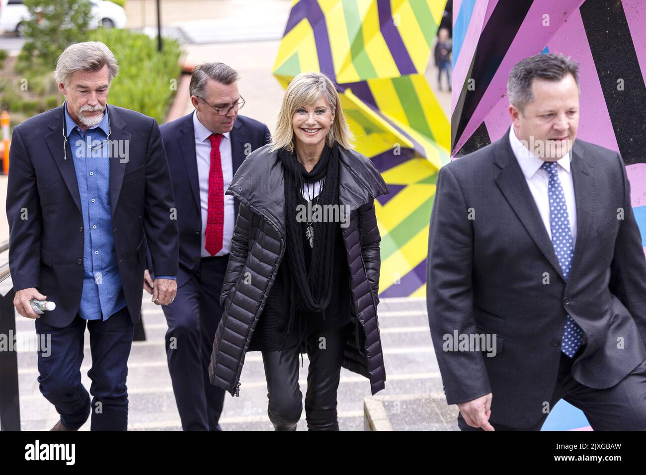 Olivia Newton-John arrives with husband John Easterling (left) ahead of ...