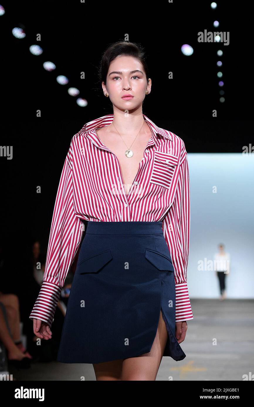 A model walks the runway wearing creations by Anna Quan during Mercedes ...