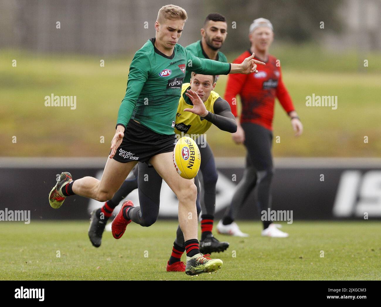 Matt Guelfi kicks the ball during an Essendon Football Club training ...