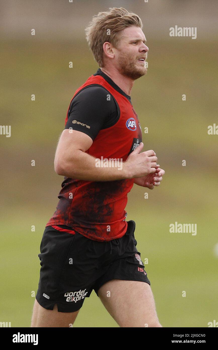 Michael Hurley runs laps during an Essendon Football Club training ...