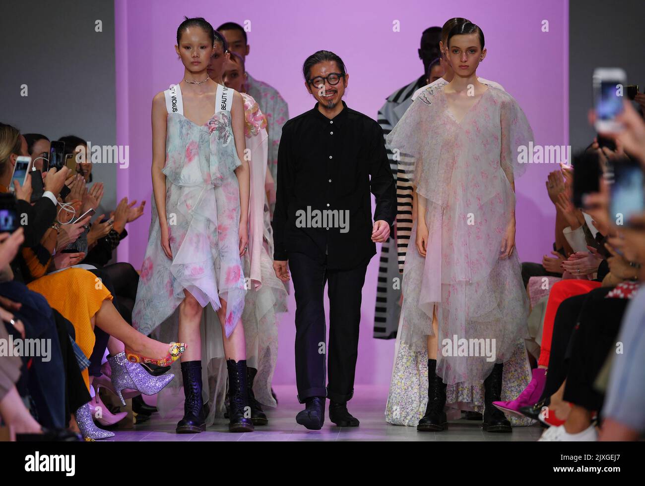 Fashio designer Akira Isogawa walks on stage after his Akira fashion ...