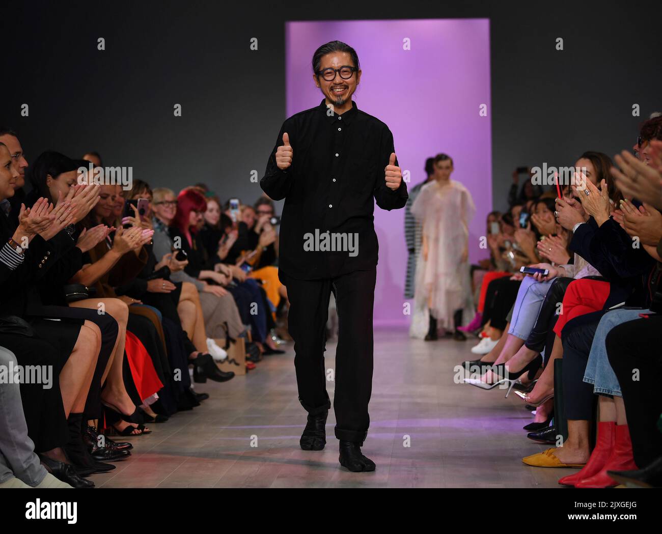 Fashio designer Akira Isogawa walks on stage after his Akira fashion show during the Mercedes ...