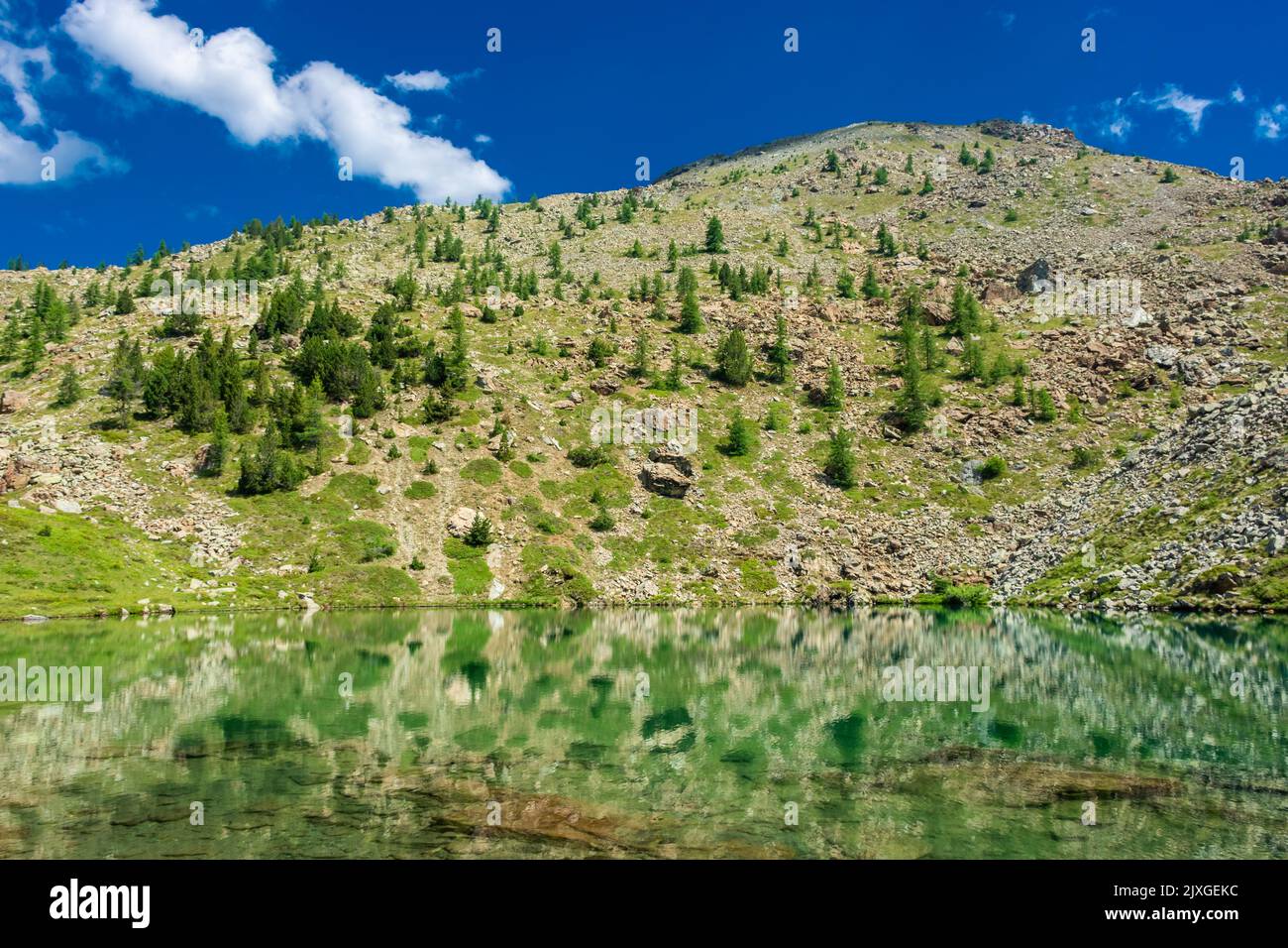 Reflection in one of the Avic Lakes in Champorcher, Aosta Valley, Italy ...