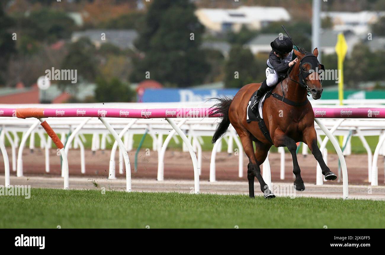 Lachlan King looks back at the chasing field as he rides Boom Time to ...