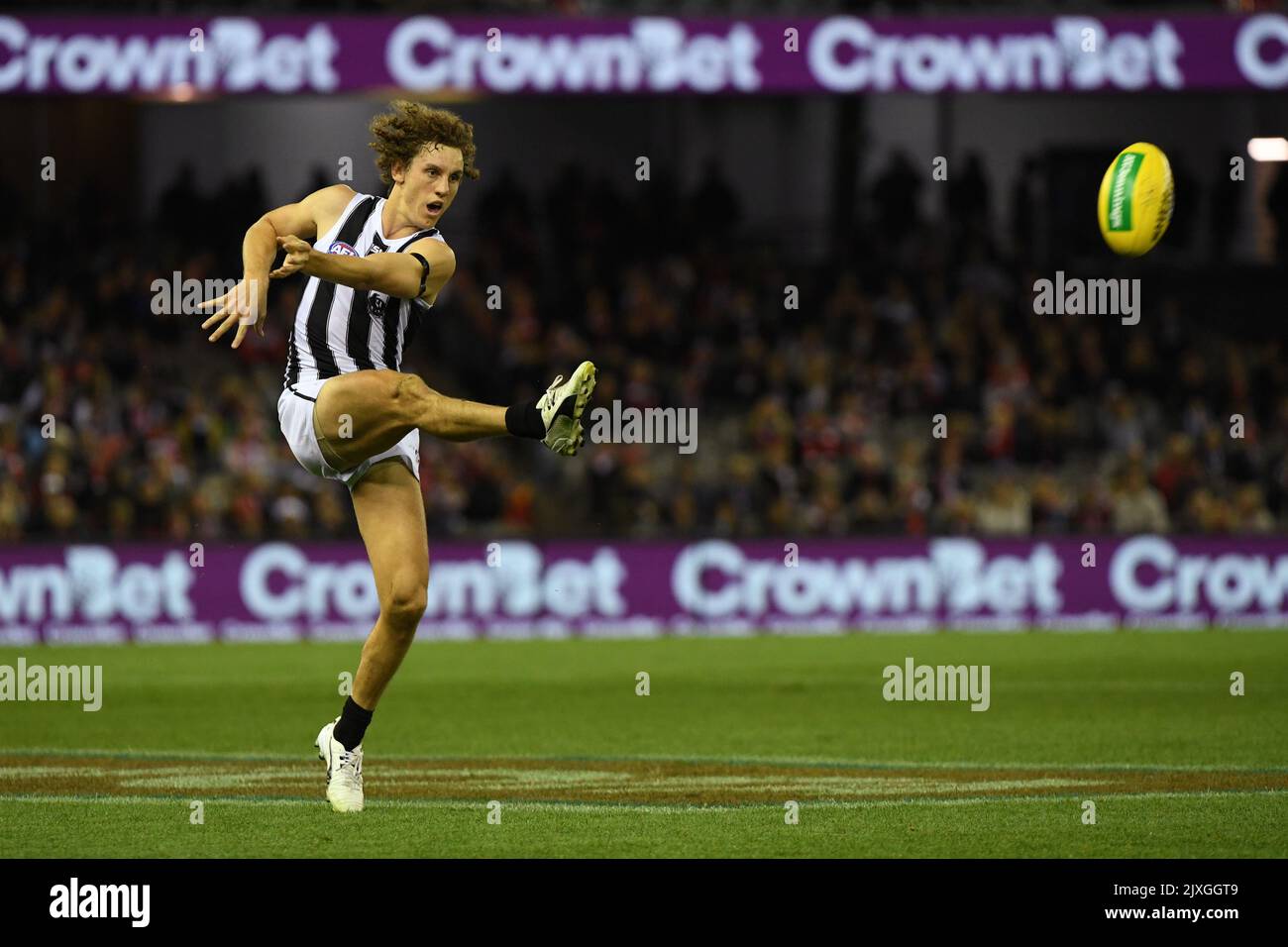 Chris Mayne of the Magpies kicks the ball during the Round 9 AFL match ...