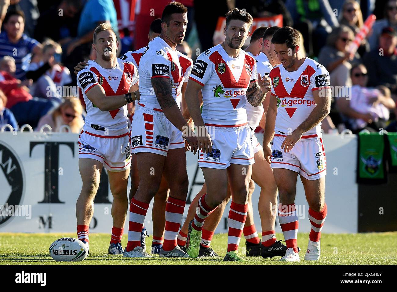 Matthew Dufty of the Dragons (left) celebrates with team mates after ...
