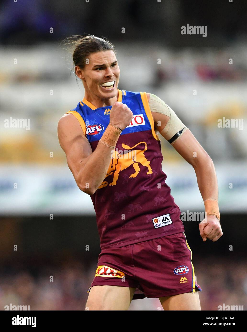 Eric Hipwood of the Lions celebrates kicking a goal during the Round 9 ...