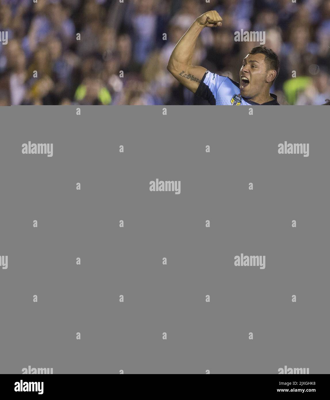 Jesse Ramien of the Sharks scores during the Round 11 NRL match between ...