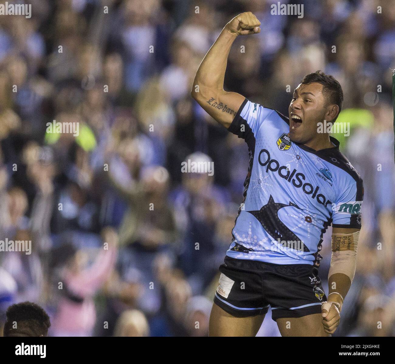 Jesse Ramien of the Sharks scores during the Round 11 NRL match between ...