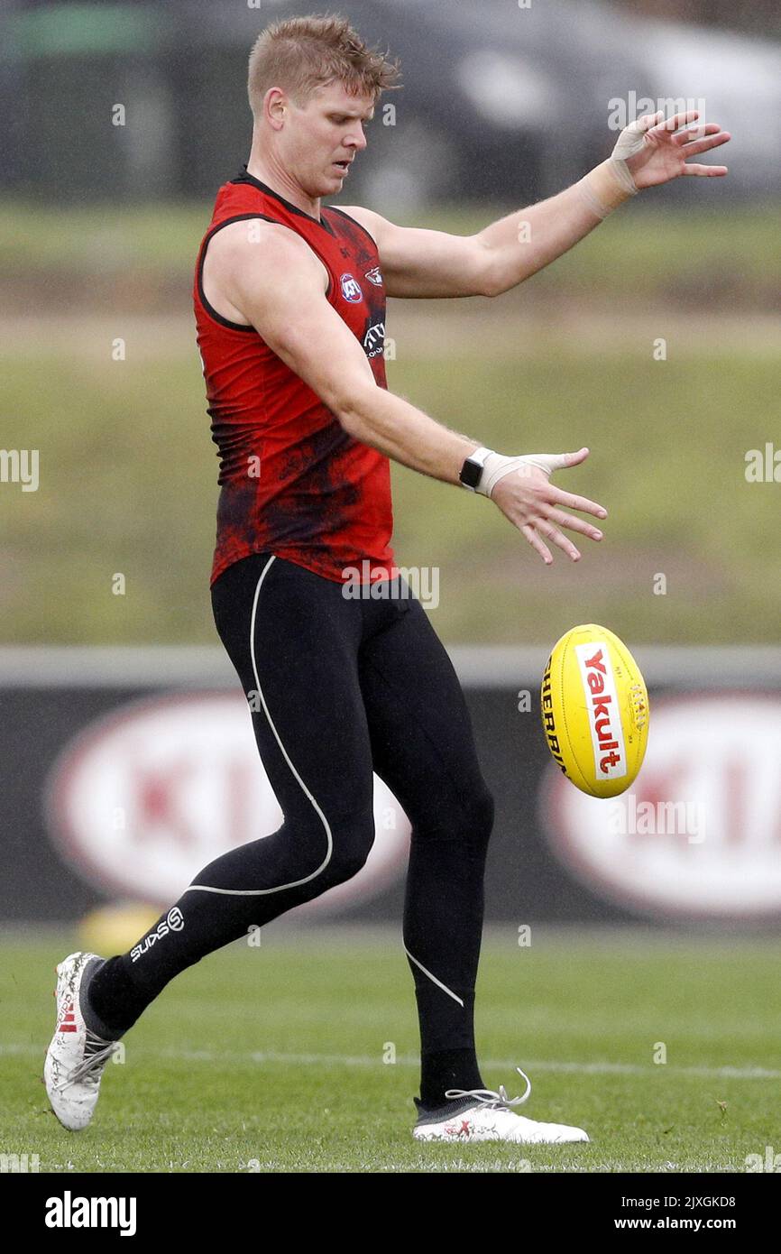Essendon Bombers player Michael Hurley kicks the ball during a team ...