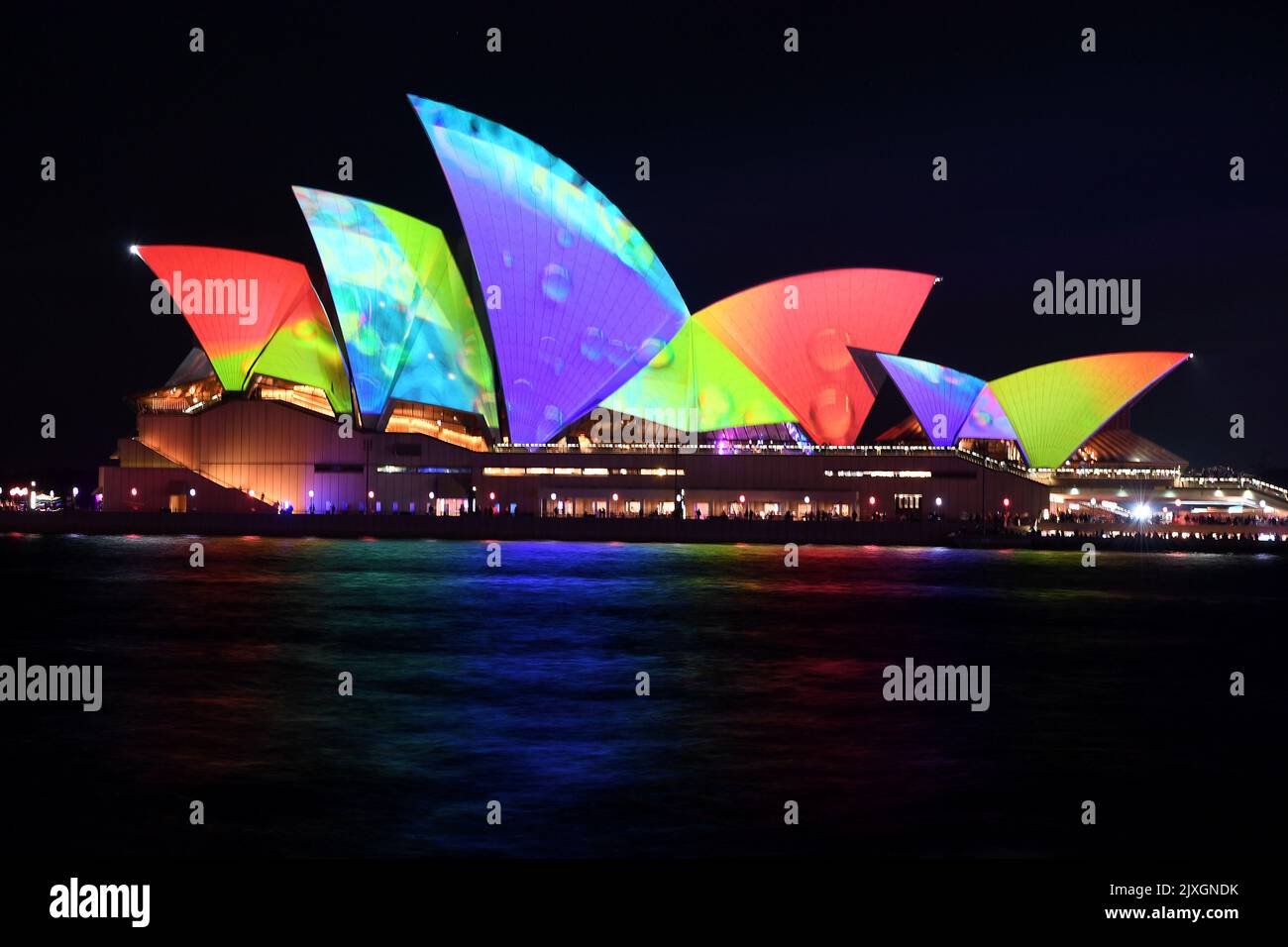 The sails on the Sydney Opera House are seen lit during the official ...
