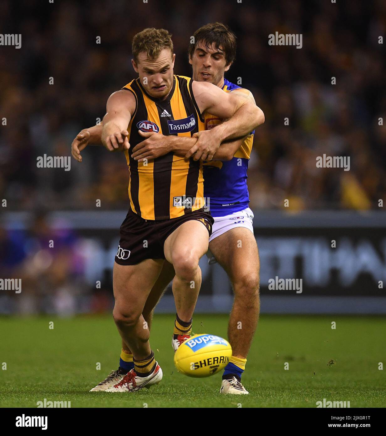 Tom Mitchell of the Hawks (left) and Andrew Gaff of the Eagles contest ...
