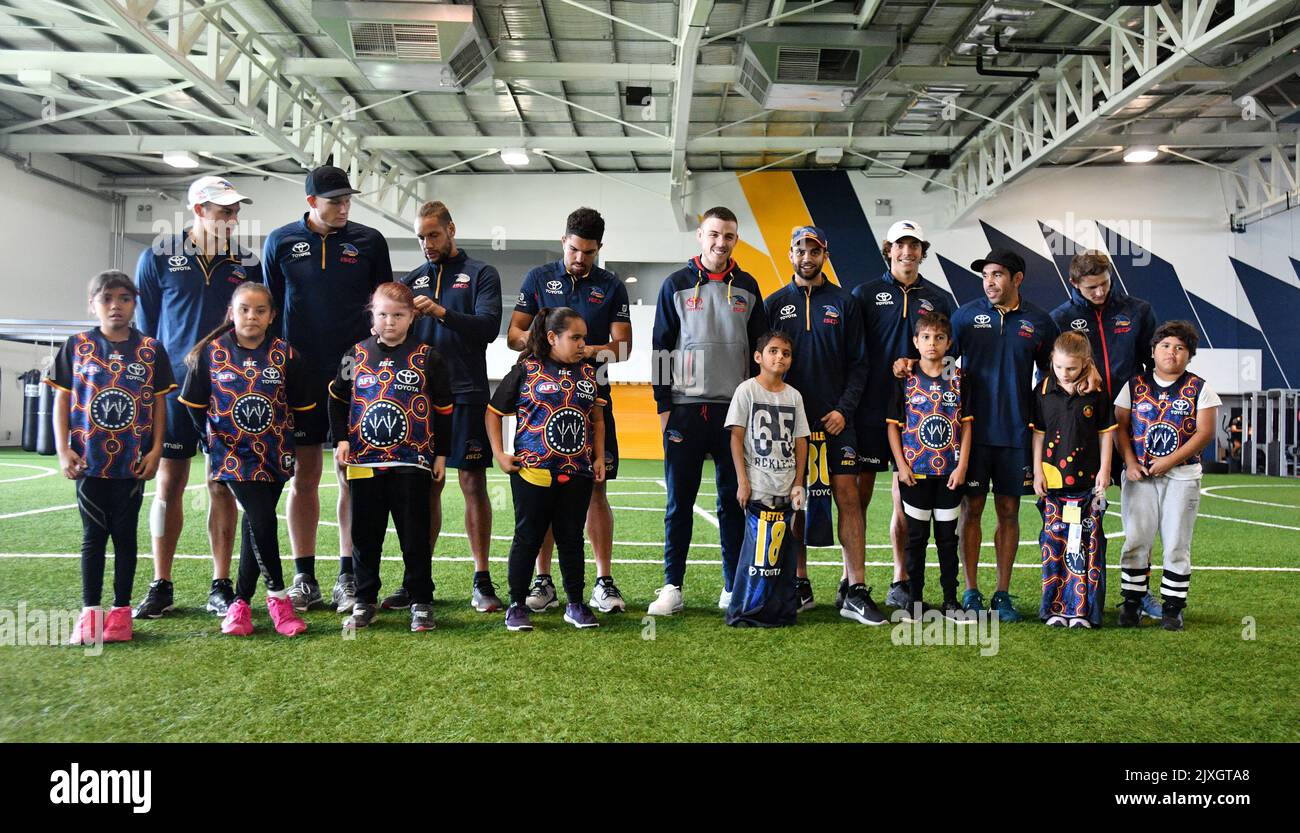 Crows players are seen handing out indigenous guernseys with indigenous ...