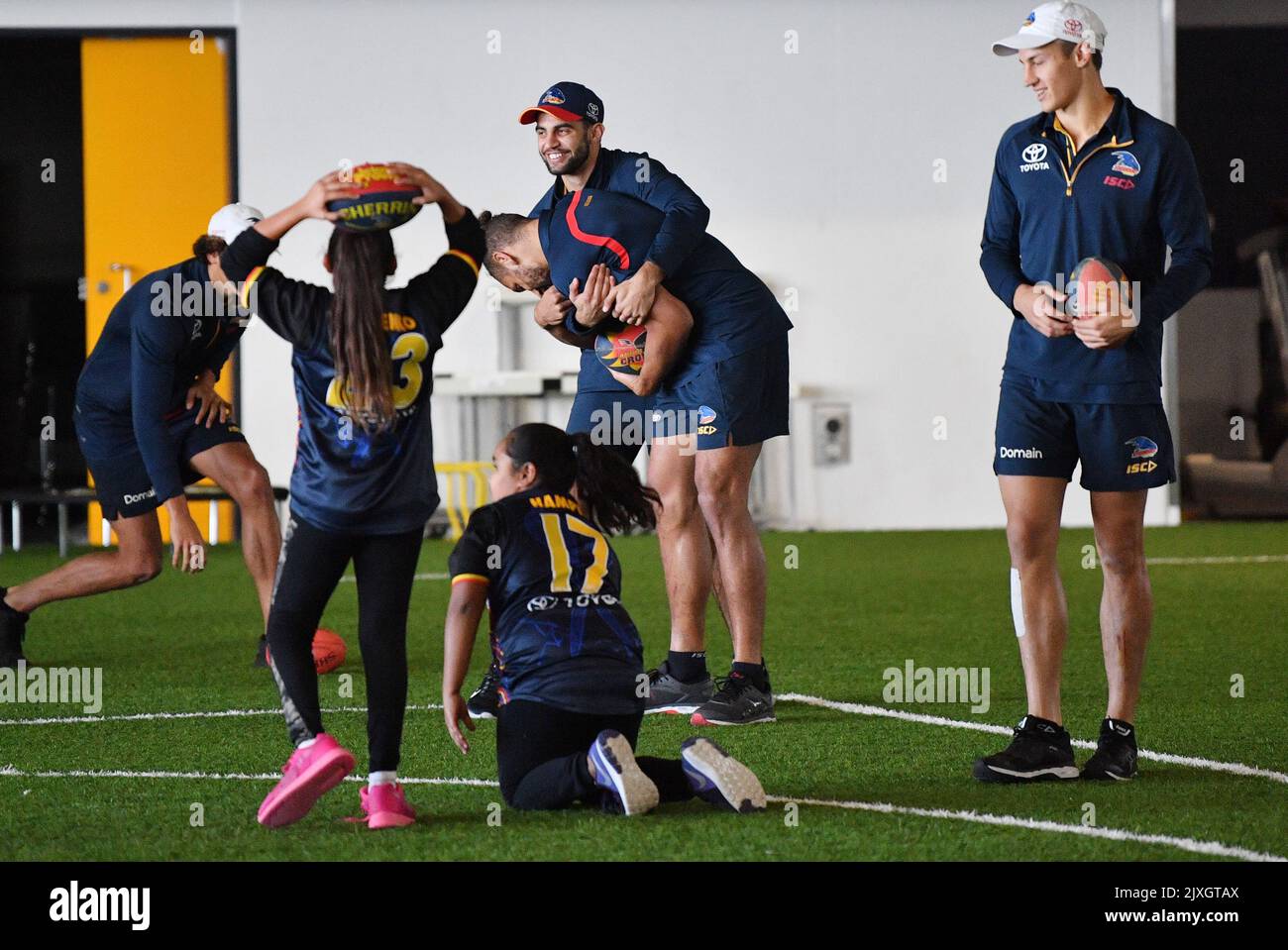 Crows players are seen with indigenous school children at the Adelaide ...