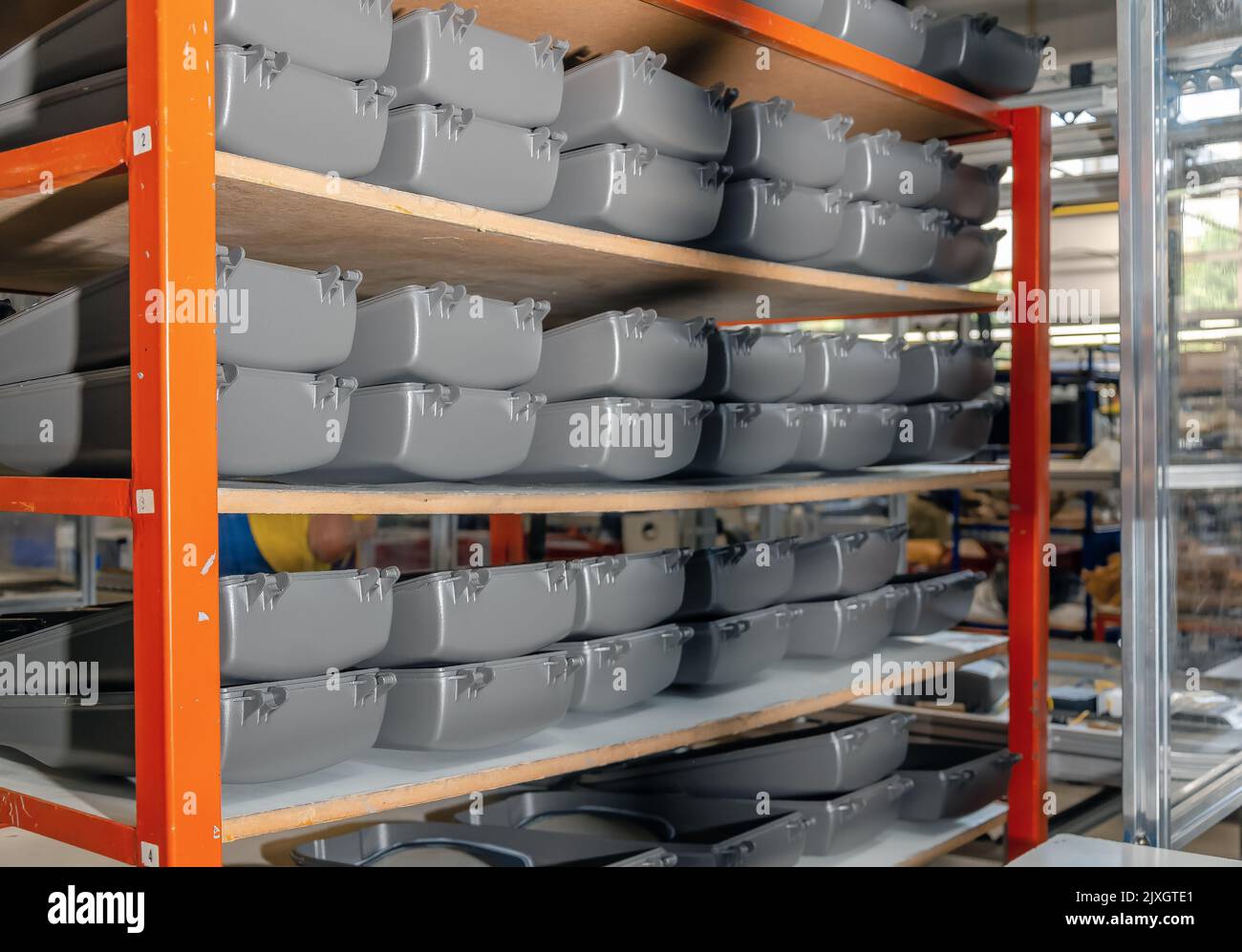 Shelves with gray plastic containers in production. Storage. Industrial ...