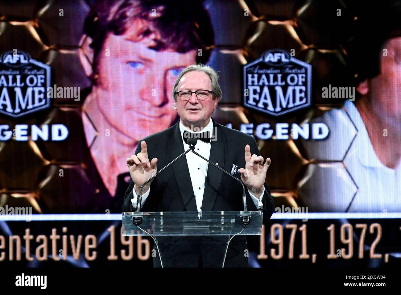 Kevin Sheedy speaks to guests after he was inducted as a Legend at the ...