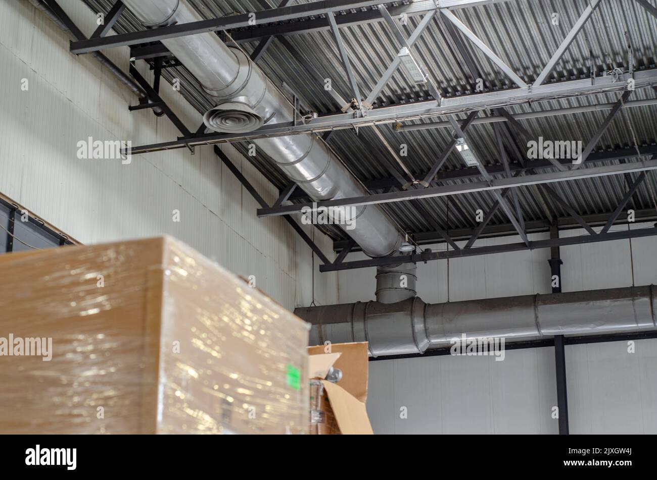 Ceiling of large factory building with artificial lighting. Industrial ...