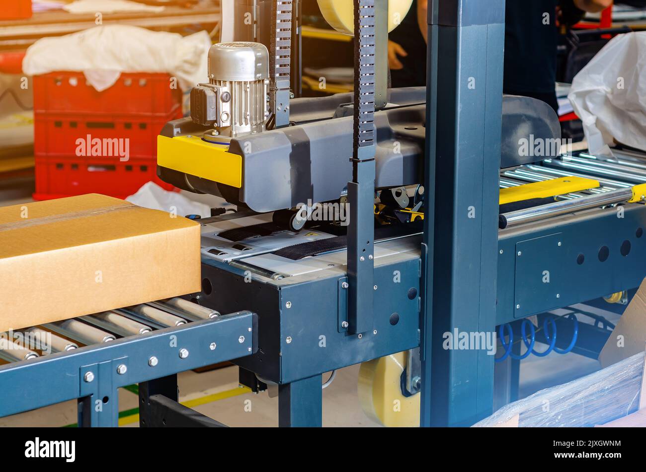 Cardboard packaging machine. Production line of packaging. Industry ...