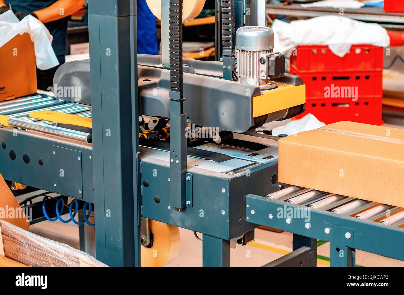 Cardboard packaging machine. Production line of packaging. Industry ...