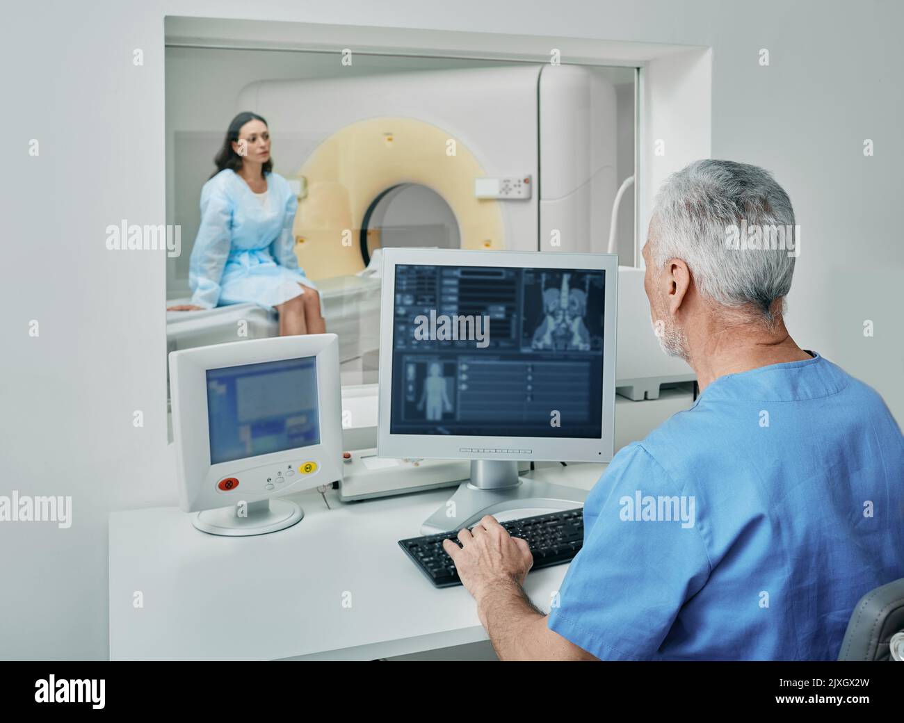 Radiologist Before Ct Scan Of Female Patients Body Using Ct Scanner