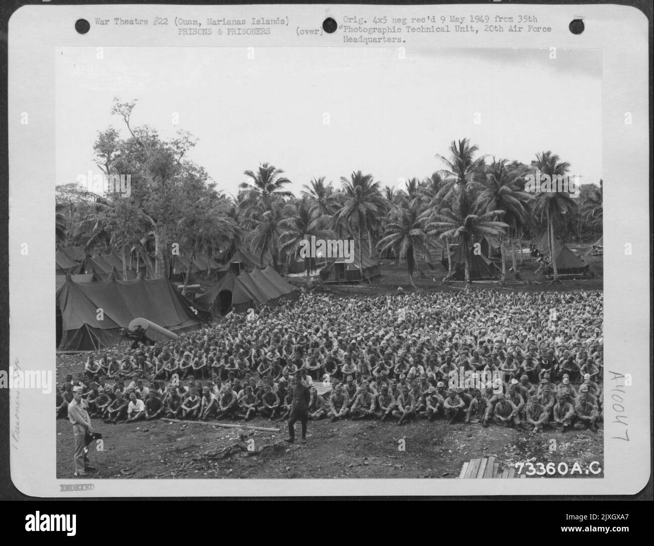 Hundreds Of Japaneses Seated On The Ground At A Prisoner Of War Camp On ...