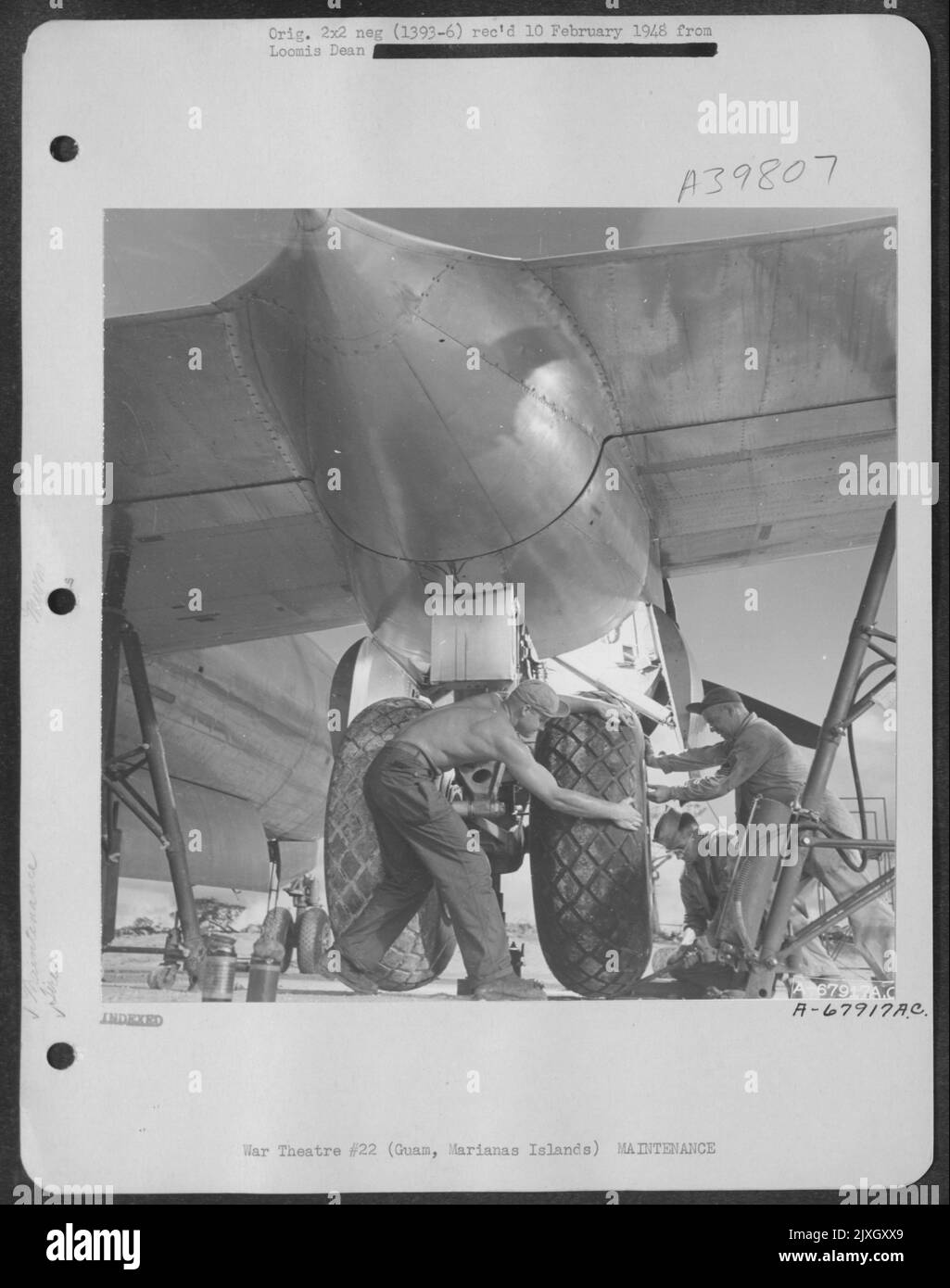 Ground Crew Members Change One Of The Huge Wheels On A Boeing B-29 ...