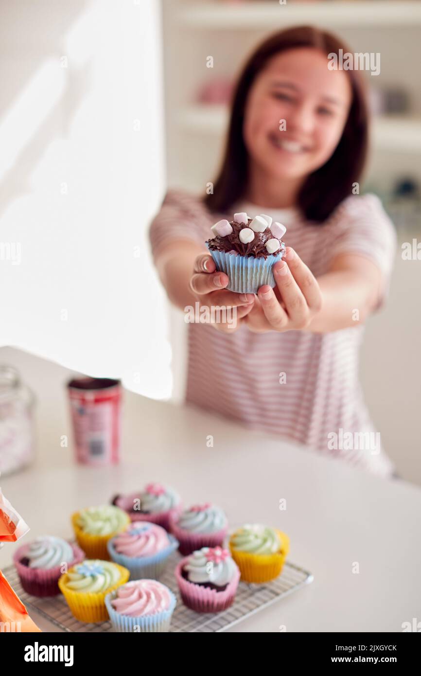 Teen girl decorating cake hi-res stock photography and images - Alamy